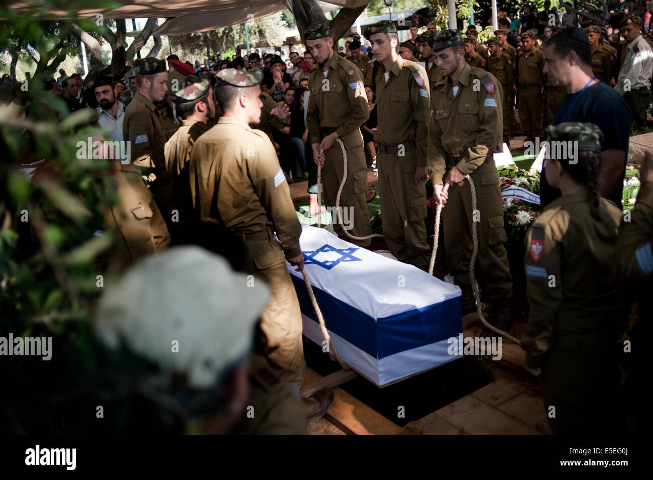 Israeli soldiers bury the coffin of Sergeant Daniel Kedmi at his ...