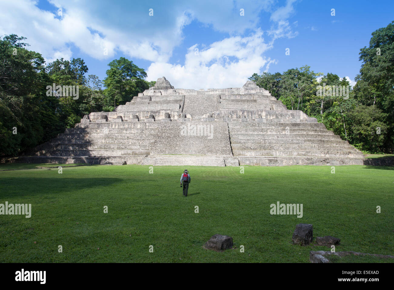 Tourist in front of the Caana pyramid at the Caracol Maya city, Cayo ...