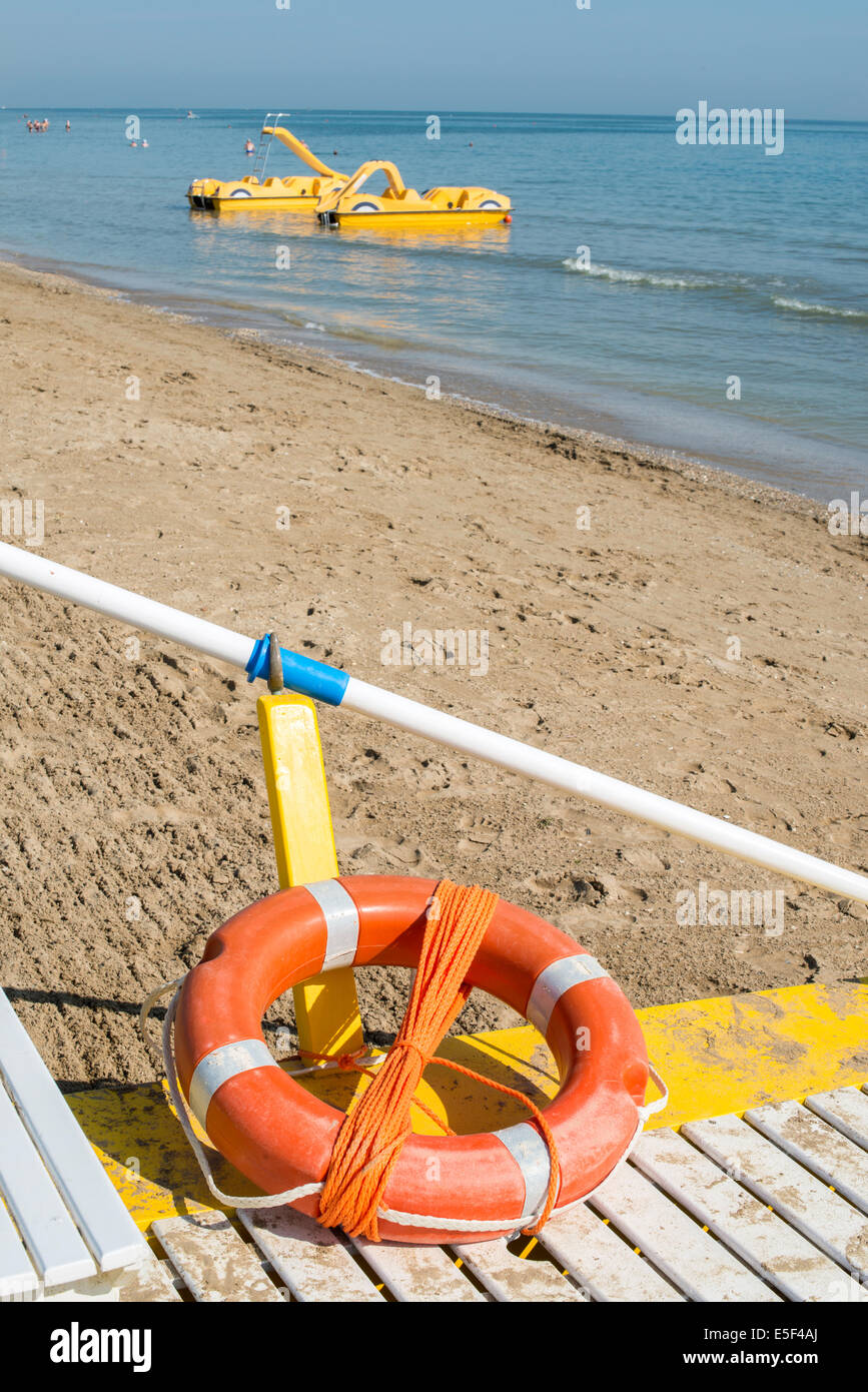 Yellow lifeboat on the beach. Italian beach Stock Photo - Alamy