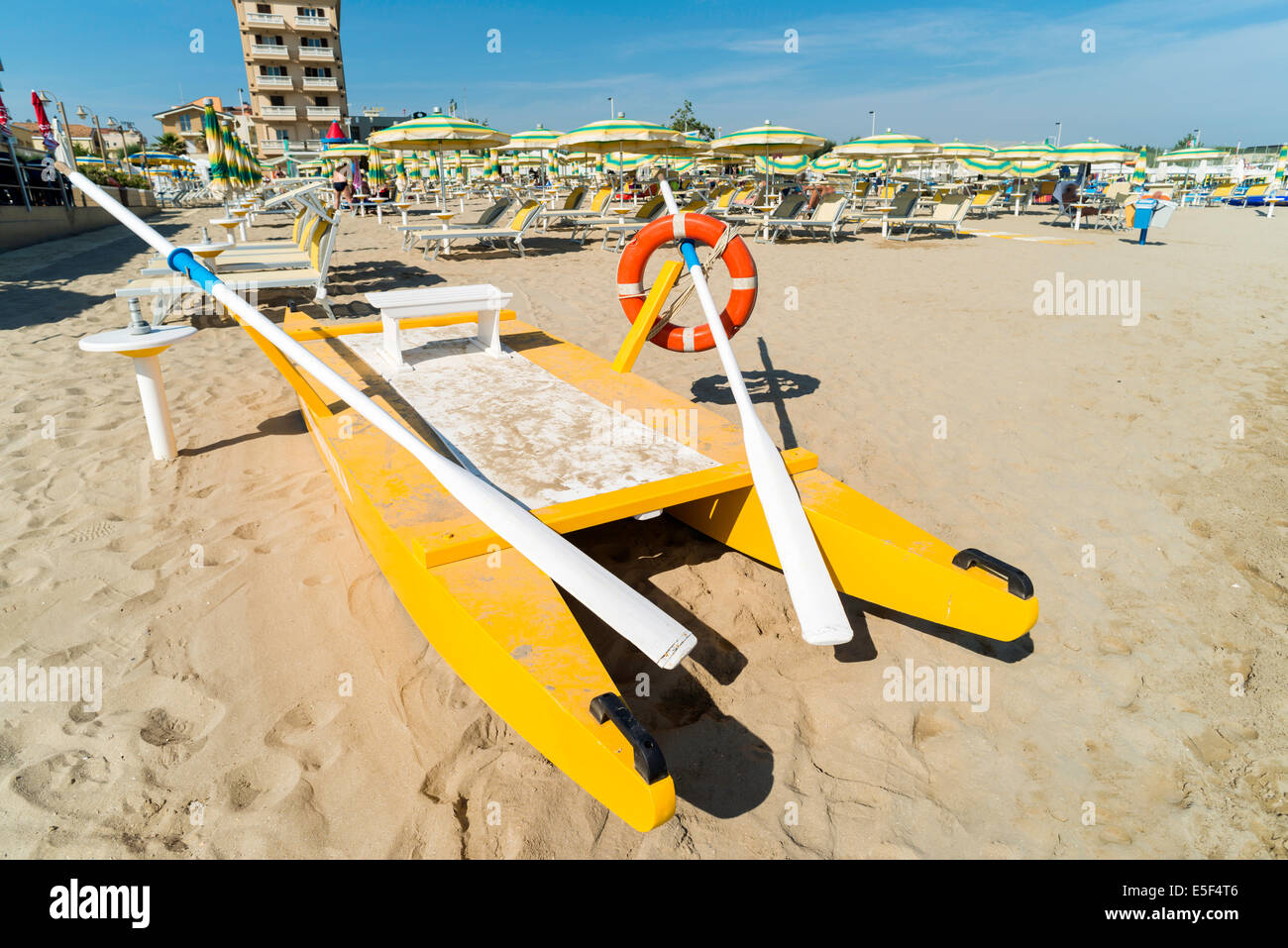 Yellow lifeboat on the beach. Italian beach Stock Photo - Alamy