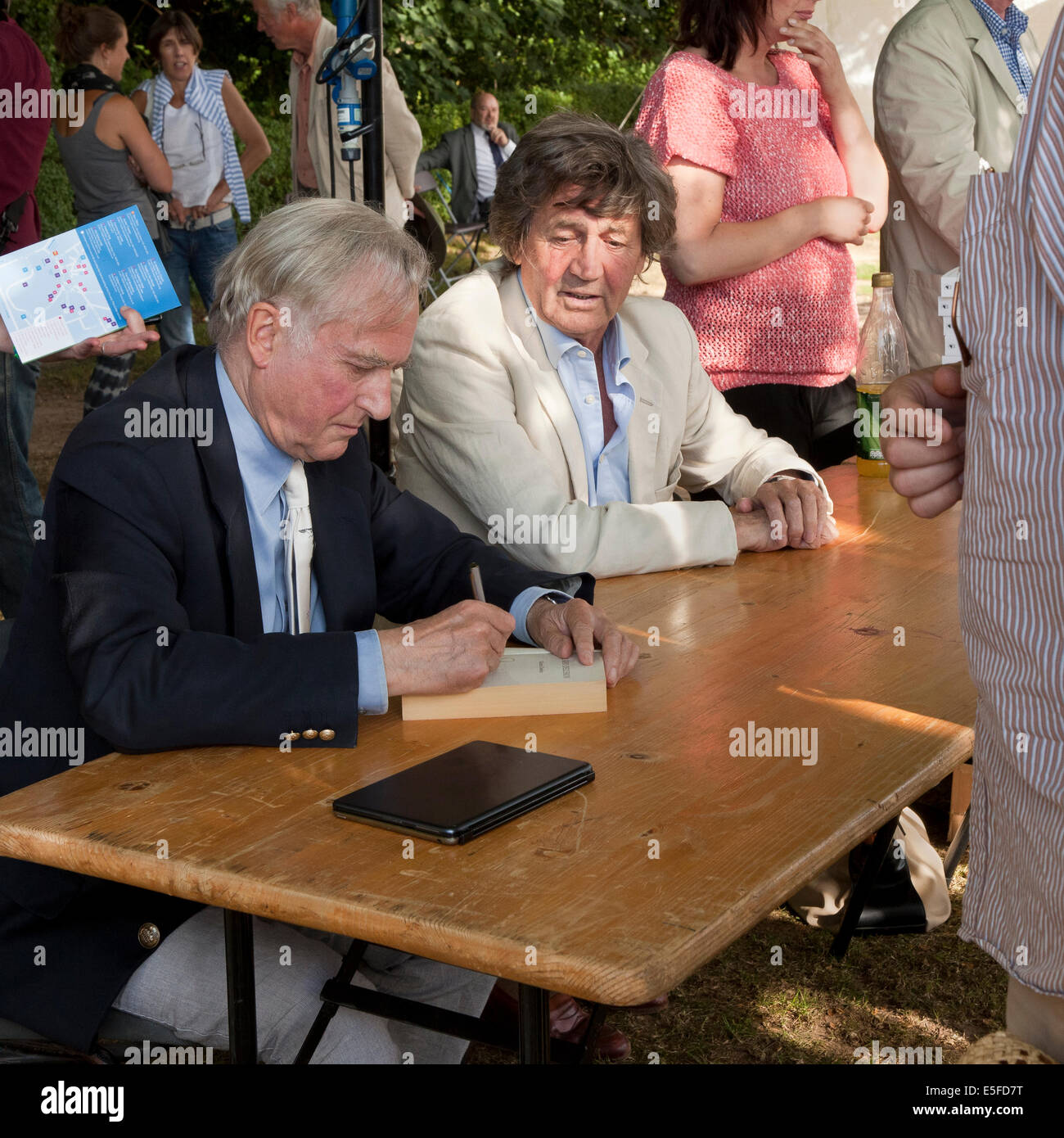 Professor Richard Dawkins and Lord Melvyn Bragg signing their books at ...