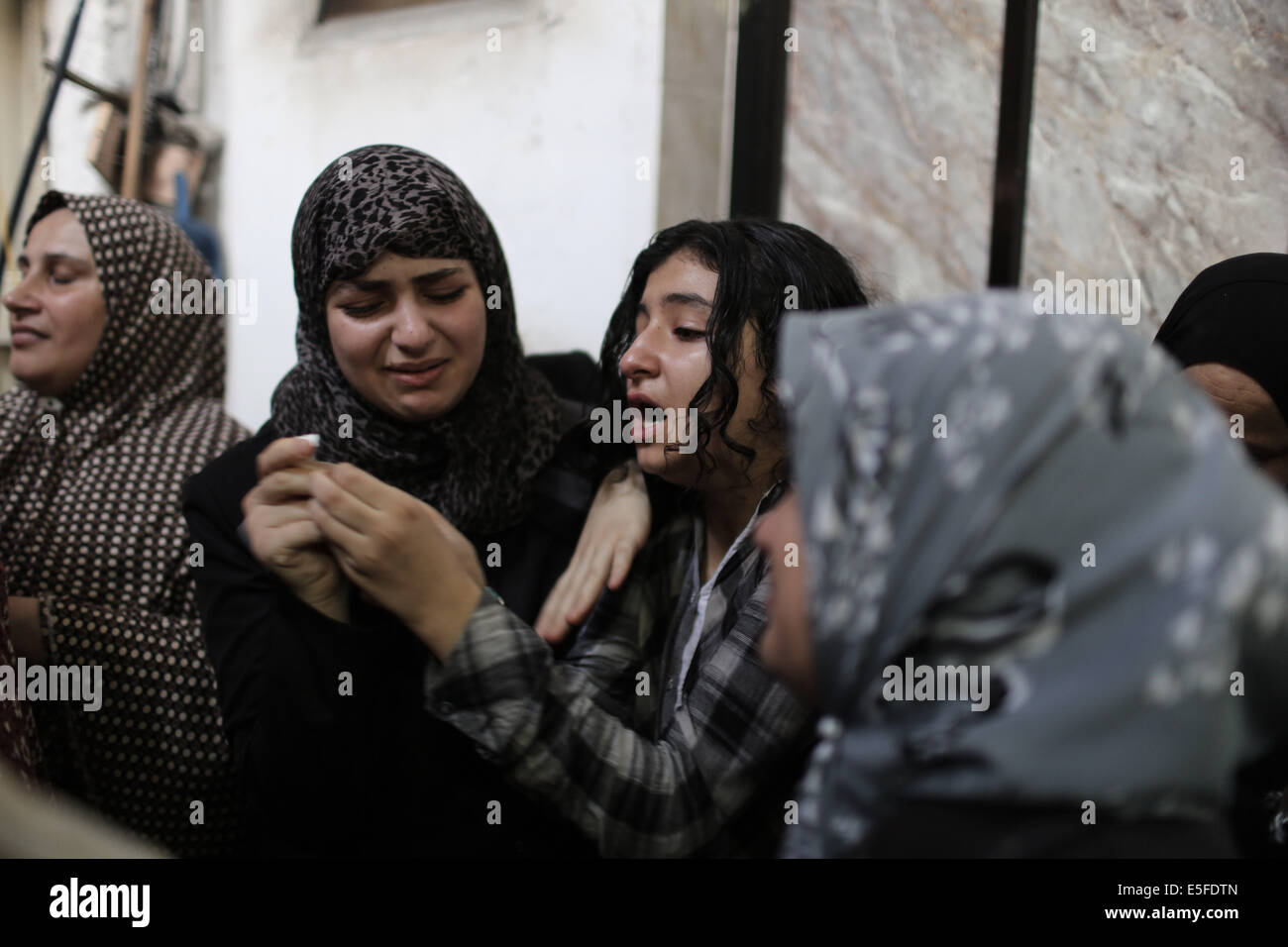 Relatives of Palestinians Samir and Basheer Hajjar mourn during their ...