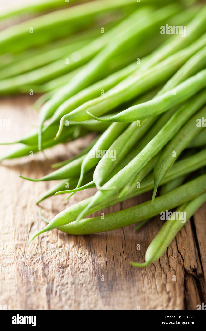fresh green beans over wooden background Stock Photo - Alamy