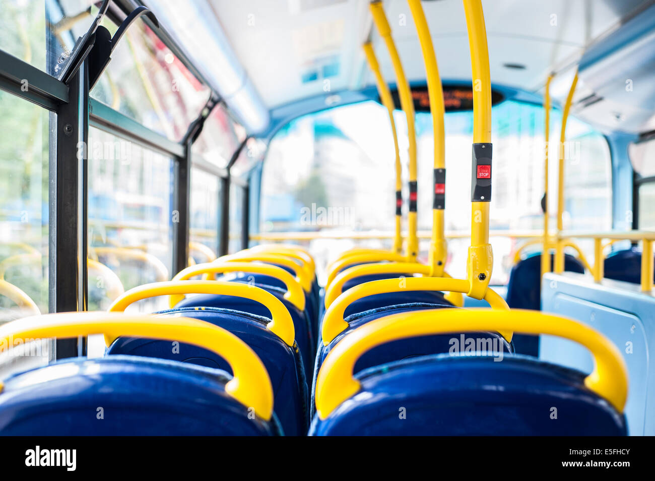 Empty seats on a London Bus and bus stop button for getting off Stock ...