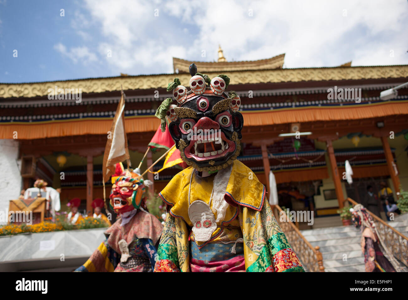 Tibetan Buddhist monks in costume and do a traditional dance in Leh ...