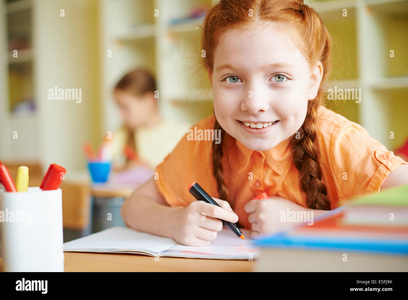 Portrait of lovely girl drawing at workplace at lesson Stock Photo - Alamy