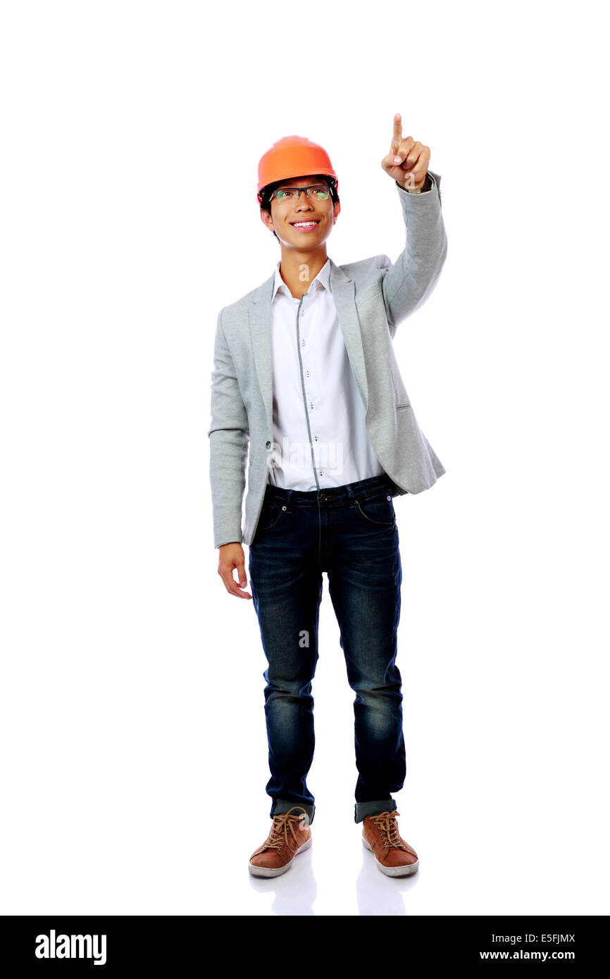 Full length portrait of asian engineer man point up isolated on white ...