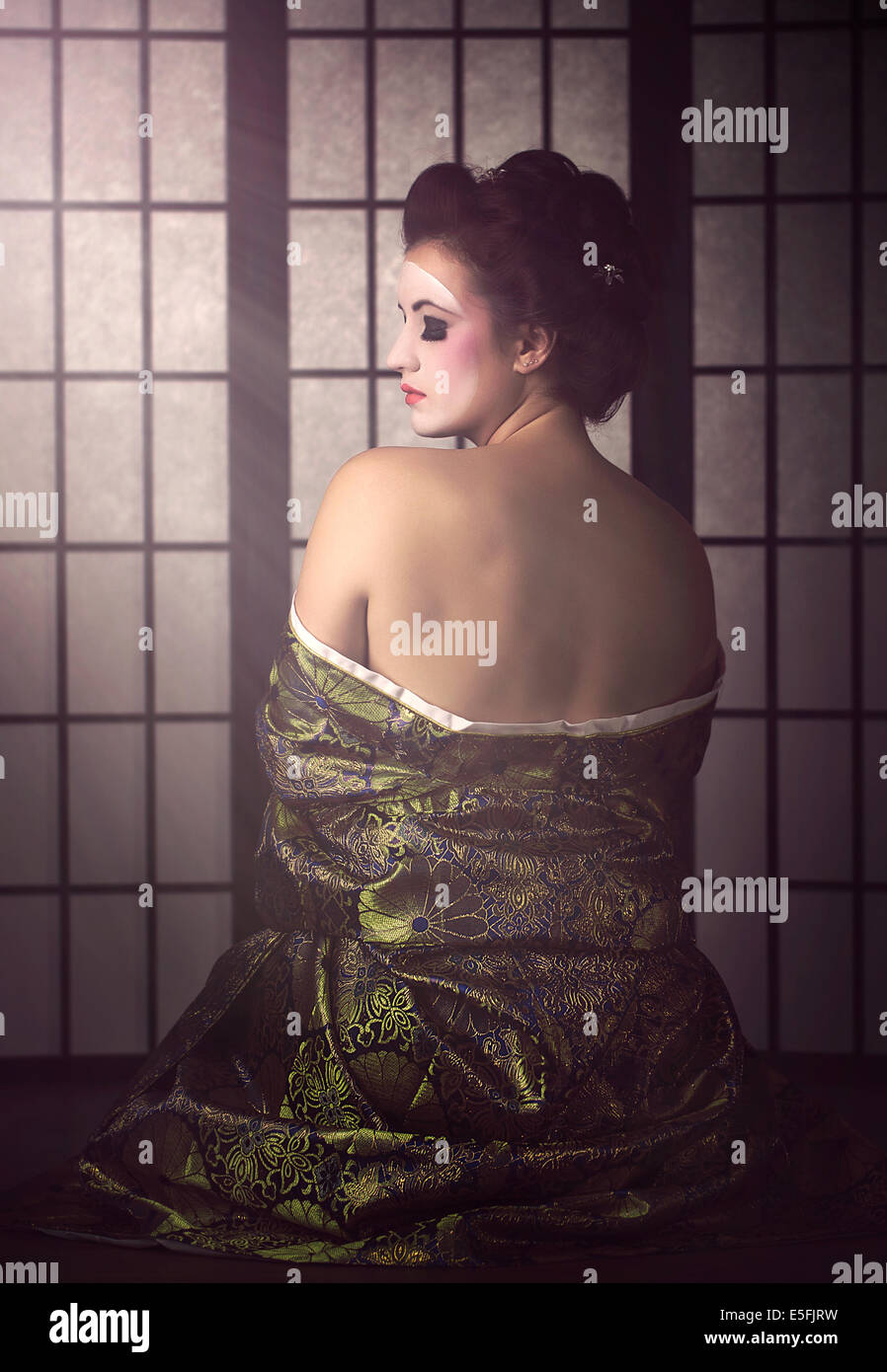 Young geisha taking her kimono off Stock Photo - Alamy