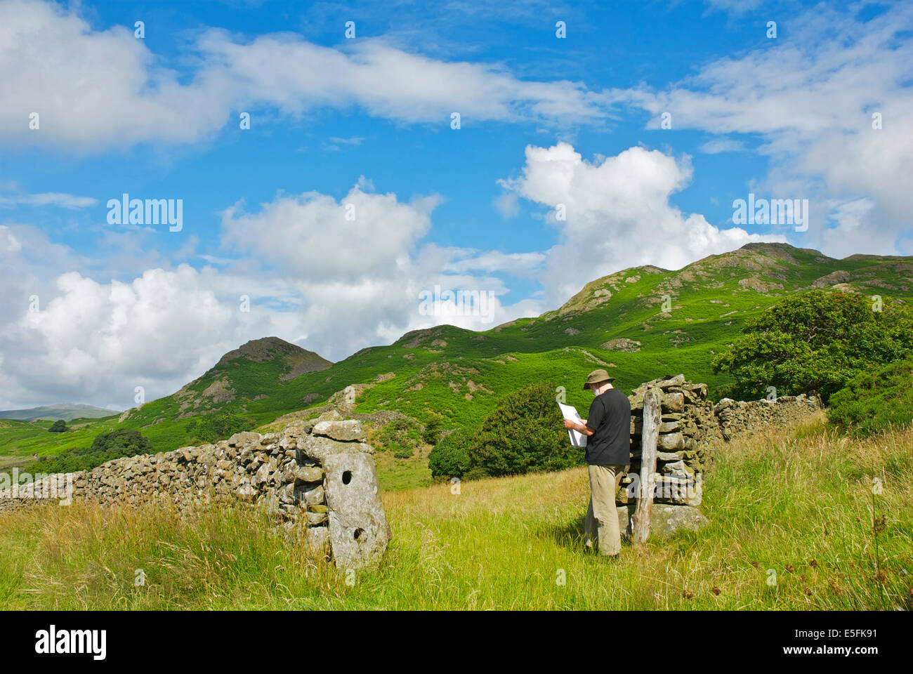Senior map reading OS map, Lickle Valley, Lake District National Park ...