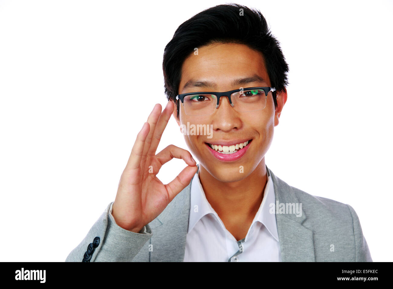 Happy asian man showing okay sign isolated on white background Stock ...