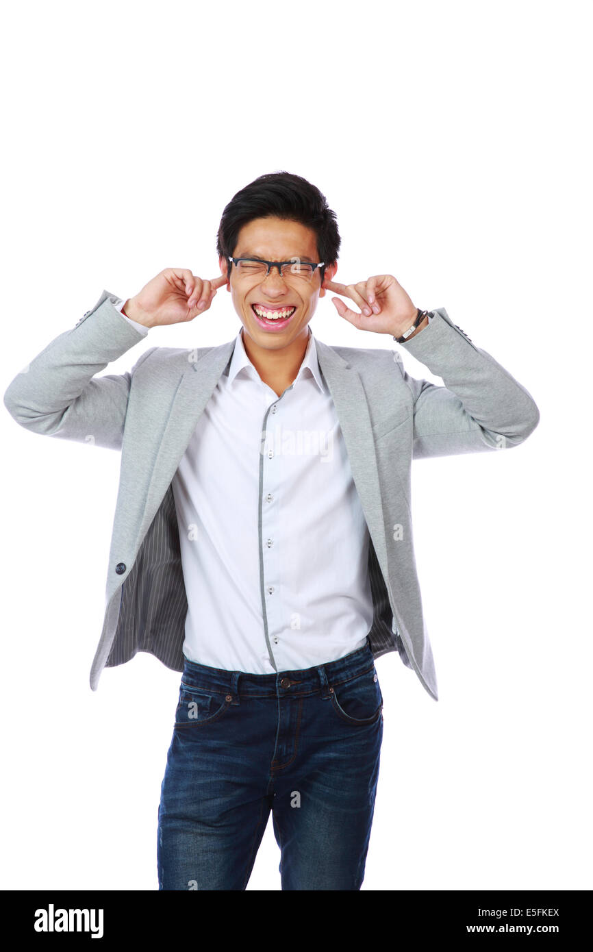 Portrait of man holding hands to ears covering to shut out noise Stock ...