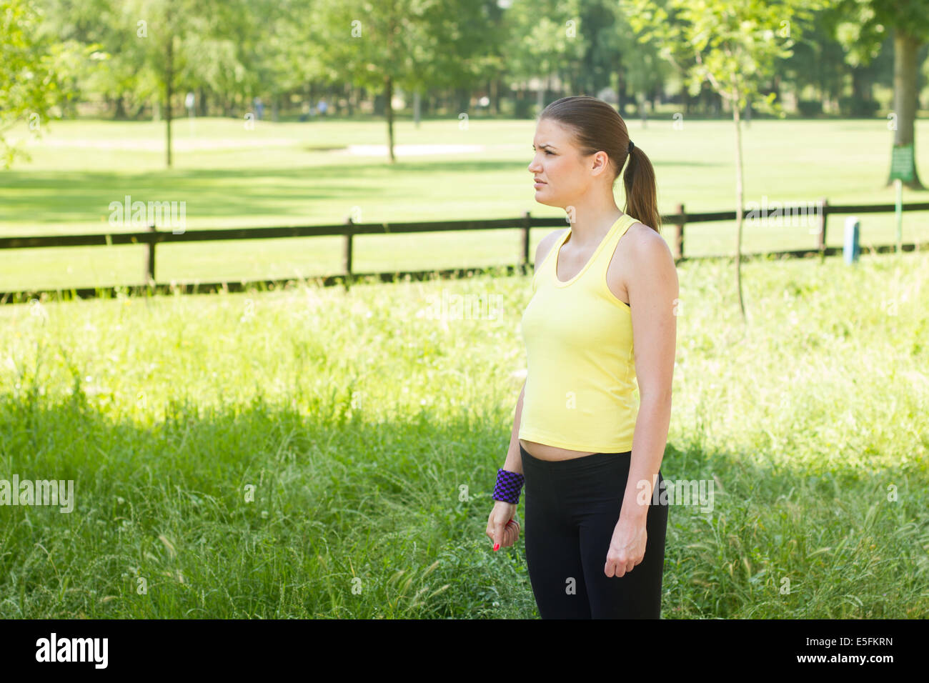 Fitness woman ready for exercising in nature Stock Photo - Alamy