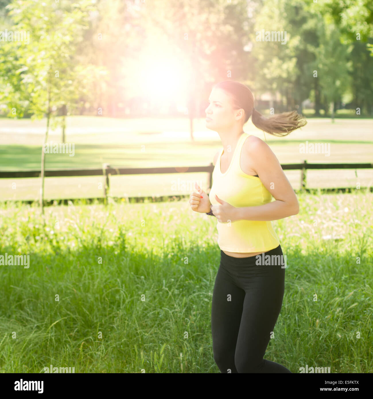 Running woman. Fitness girl jogging in nature Stock Photo - Alamy