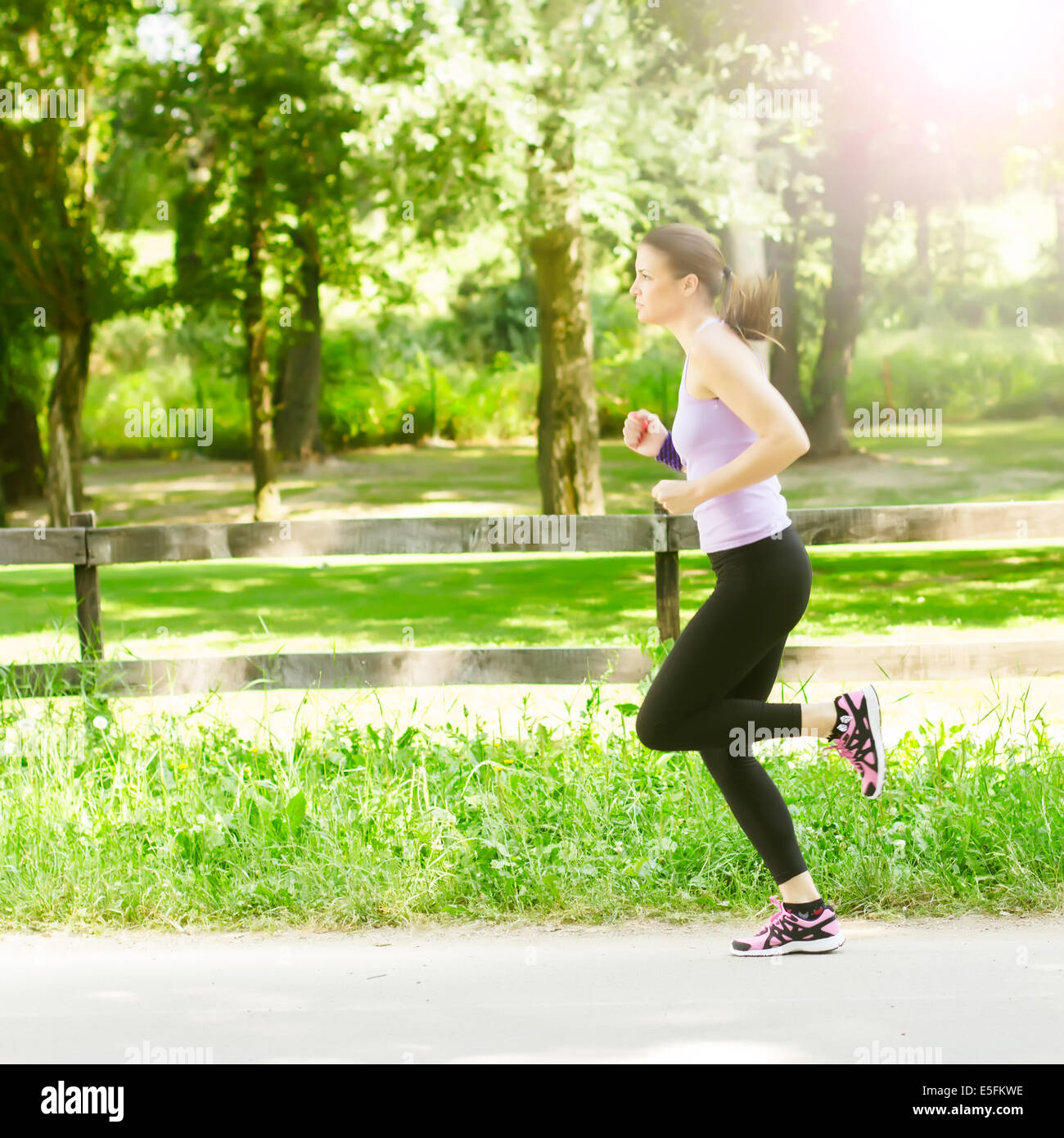 Running woman. Fitness girl jogging in nature Stock Photo - Alamy