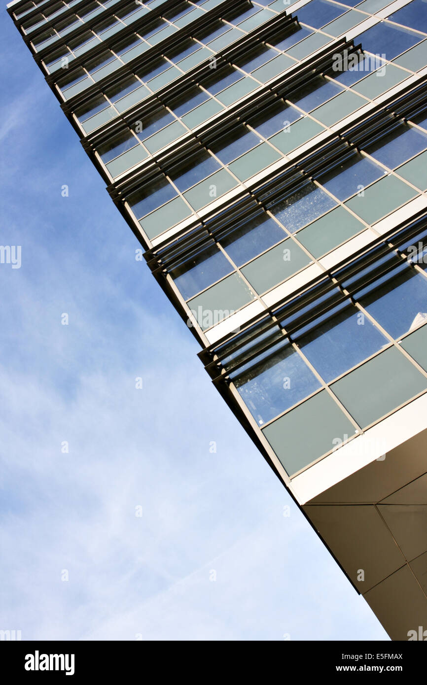Corner of modern office building toned in blue color Stock Photo - Alamy