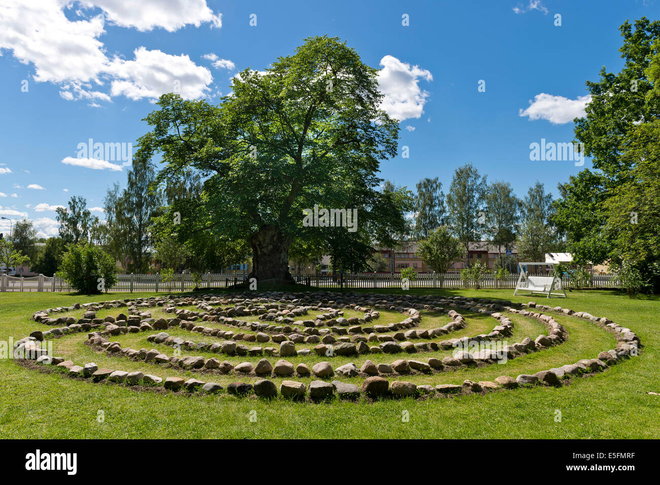 Stone word labyrinth "Möten" by the artist Magnus Lönn, behind a 200 ...