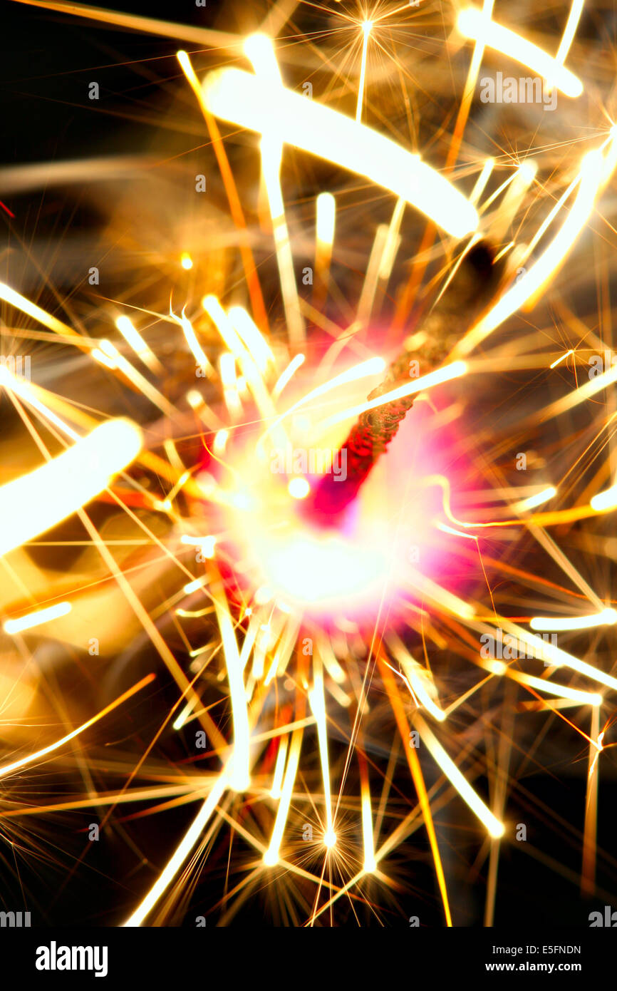 Sparkler on fire close-up over black background Stock Photo - Alamy