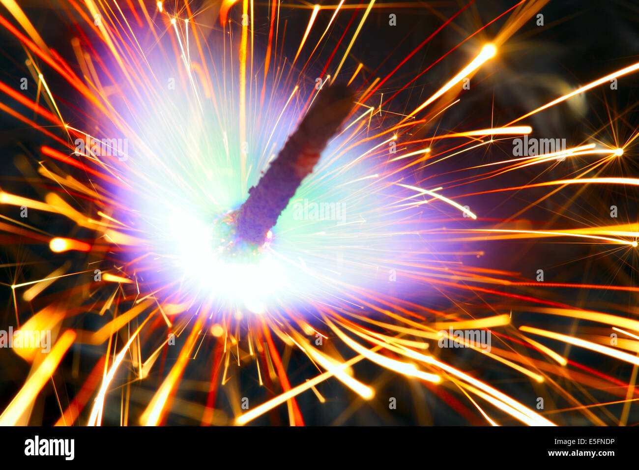 Sparkler on fire close-up over black background Stock Photo - Alamy