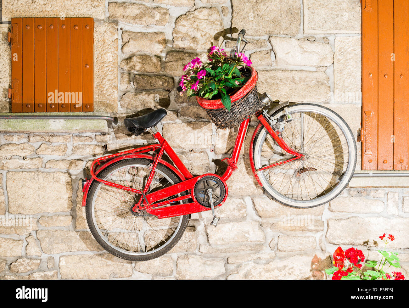 Red old Italian bicycle on sunlight. Ancient buildings Stock Photo - Alamy