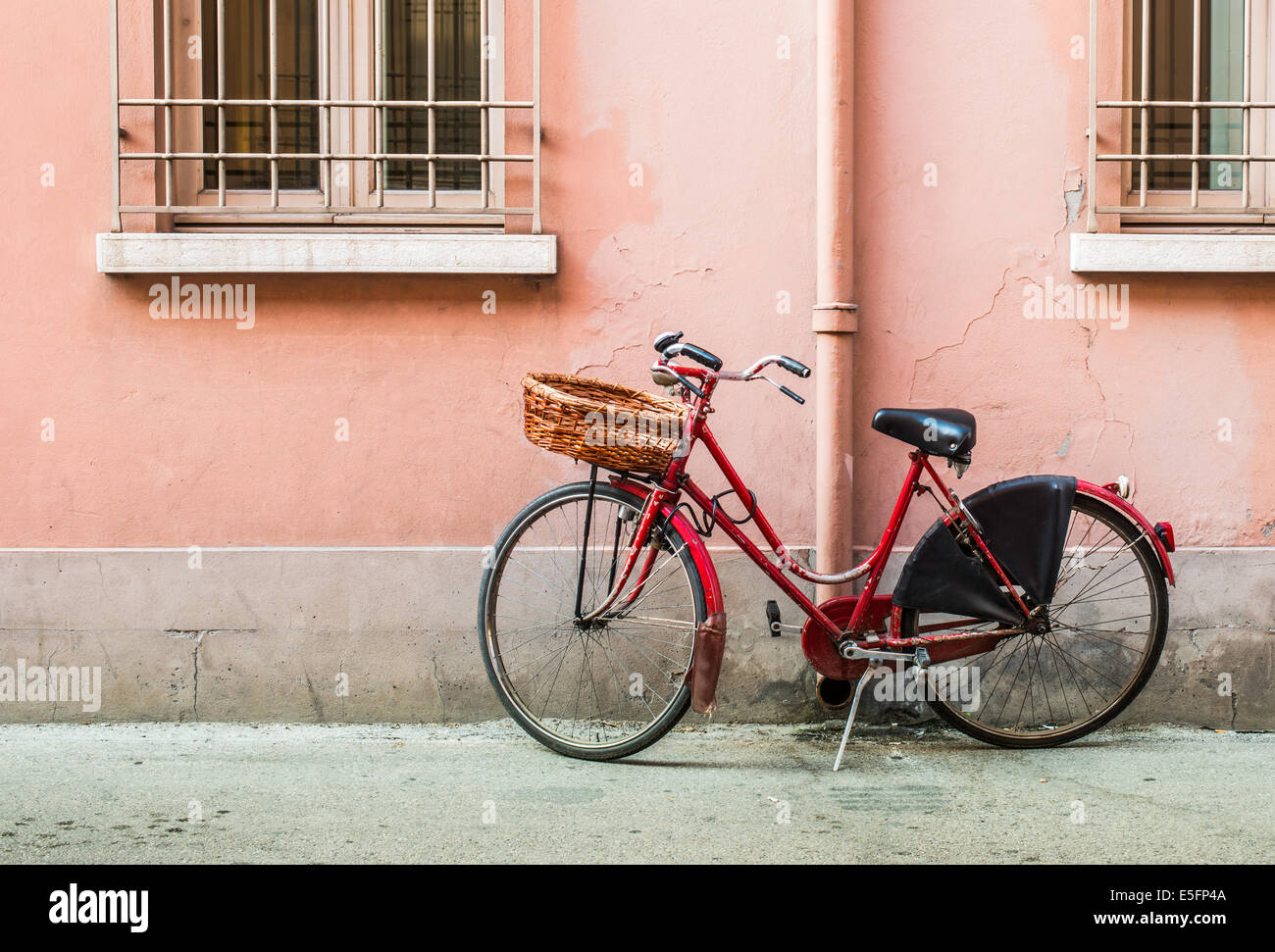 Red old Italian bicycle on sunlight. Ancient buildings Stock Photo - Alamy