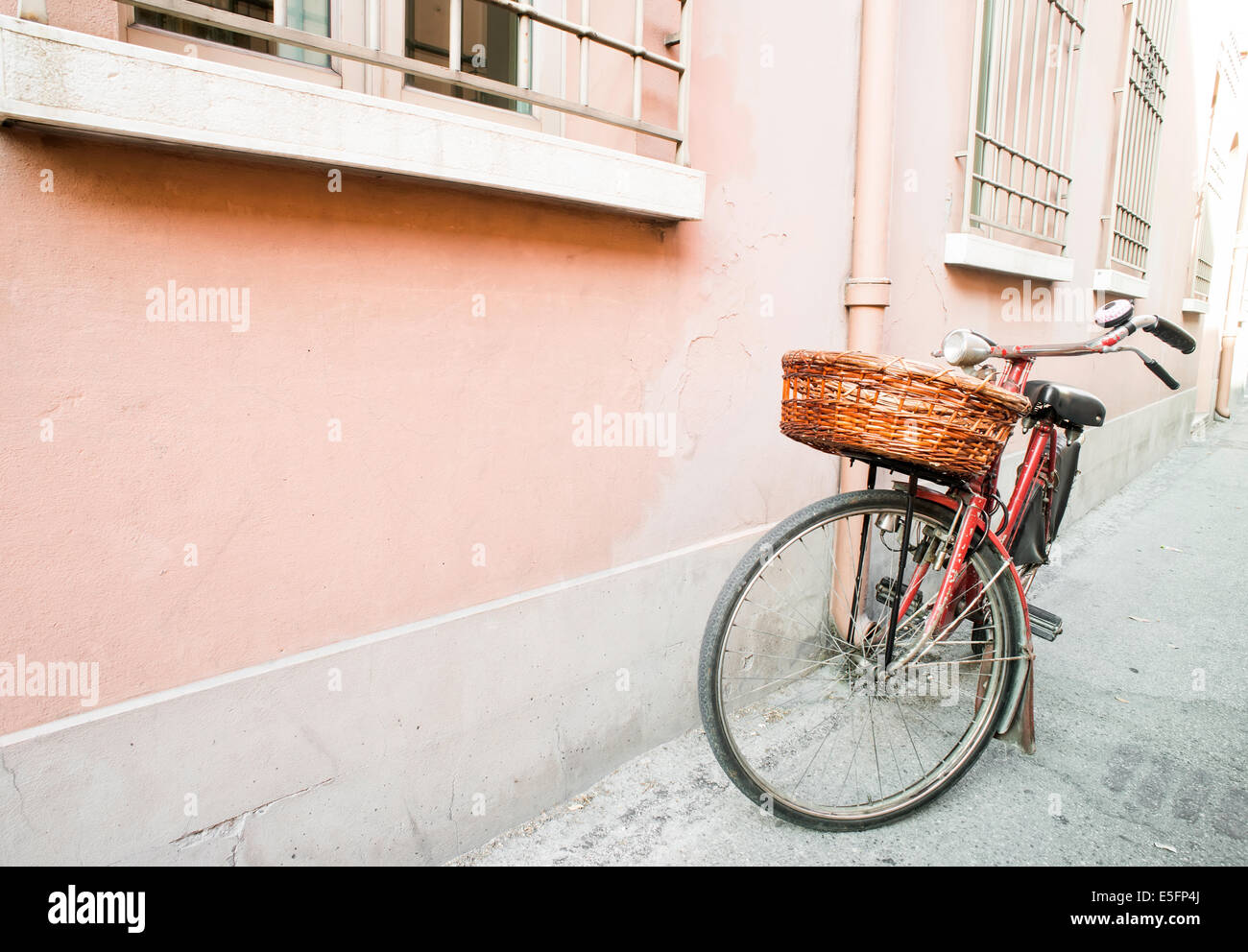 Red old Italian bicycle on sunlight. Ancient buildings Stock Photo - Alamy