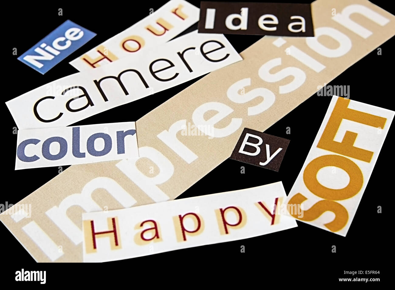 Words clipped from magazines on black background Stock Photo - Alamy