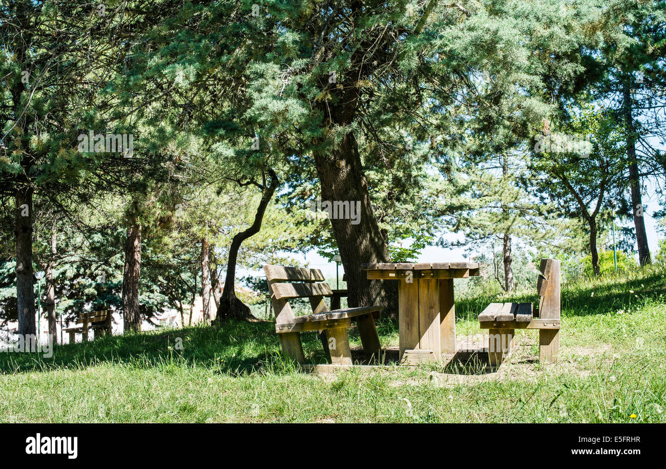 Wooden benches and a table in the woods Stock Photo - Alamy