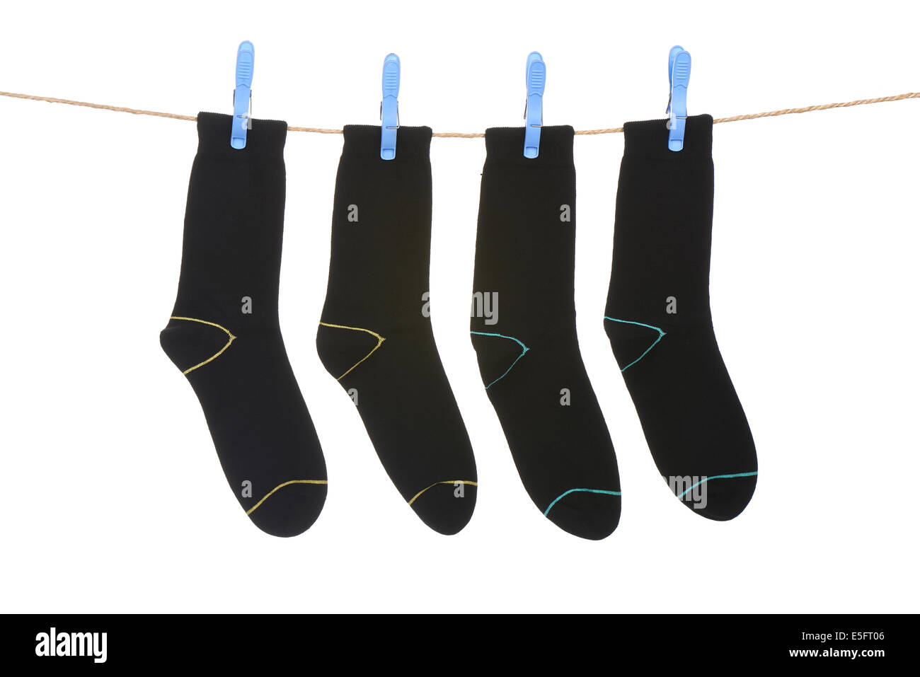socks hanging to dry over white background Stock Photo - Alamy