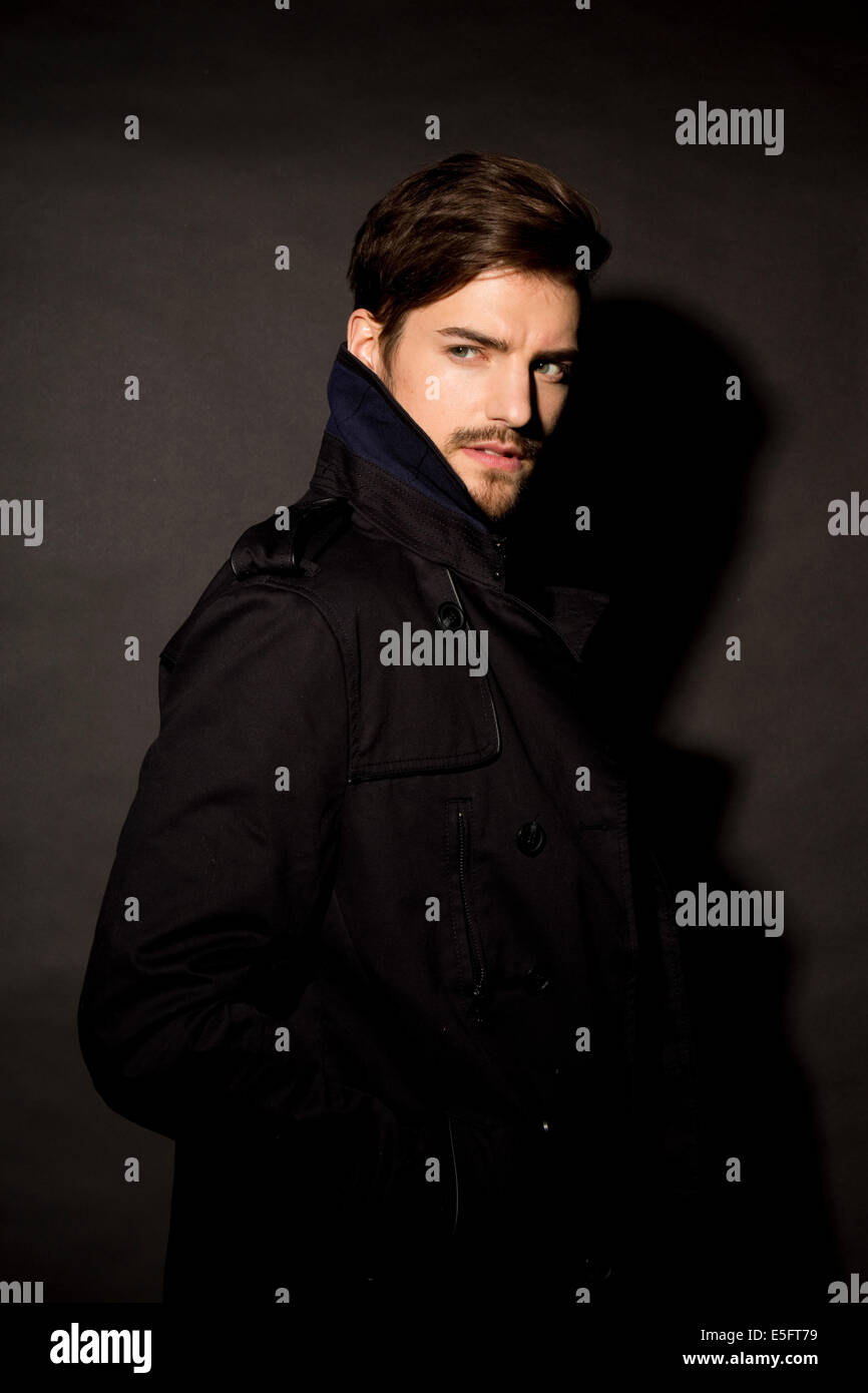 Portrait of a man wearing coat Stock Photo - Alamy