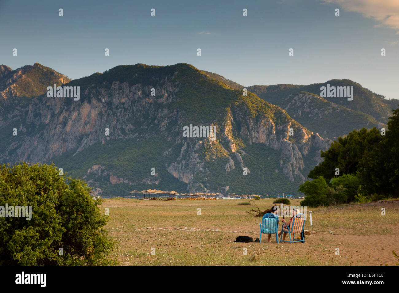 CIRALI, TURKEY Couple enjoying sunset near beach Stock Photo - Alamy
