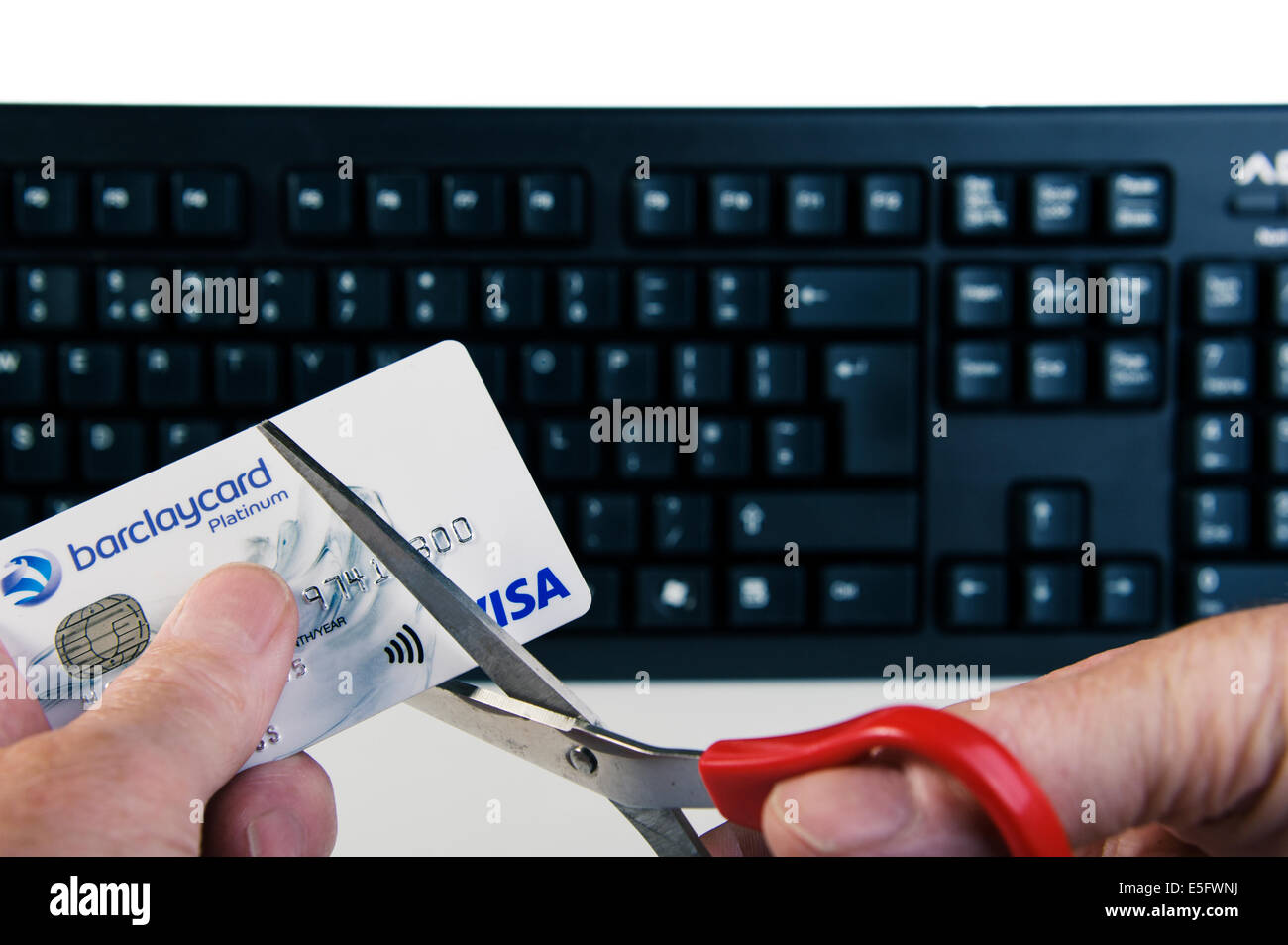 Cutting up credit card scissors hi-res stock photography and images - Alamy