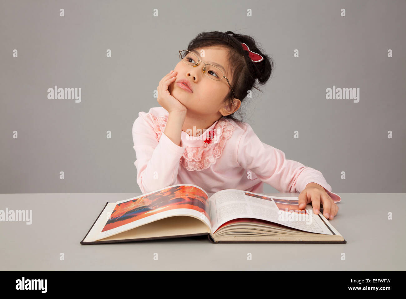 Asian chinese little girl daydreaming Stock Photo - Alamy