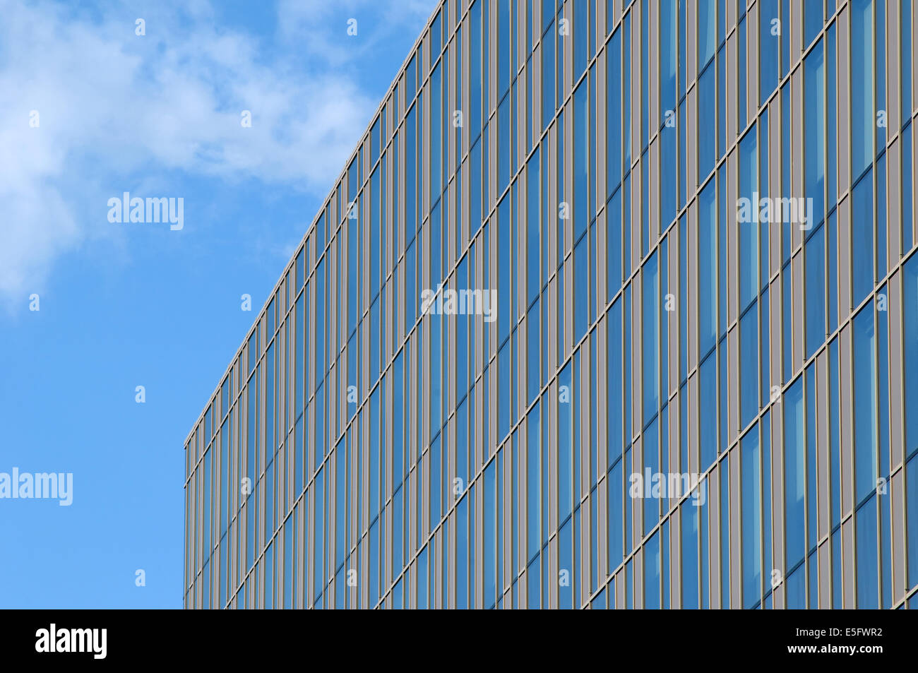 Glass building with golden stripes Stock Photo - Alamy