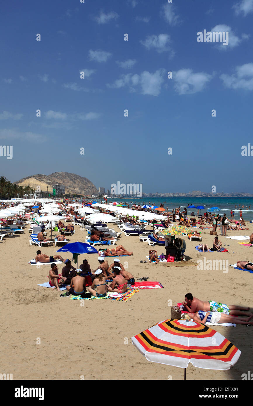 Sunbathers on the beach at Alicante City, capital of Valencia region ...