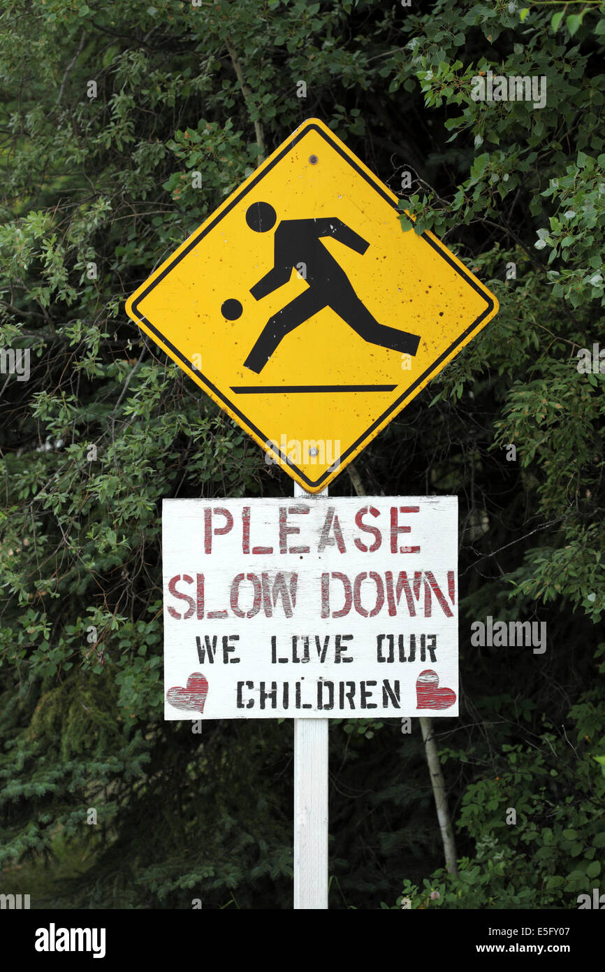A sign implores drivers to "please slow down" in Missinipe ...