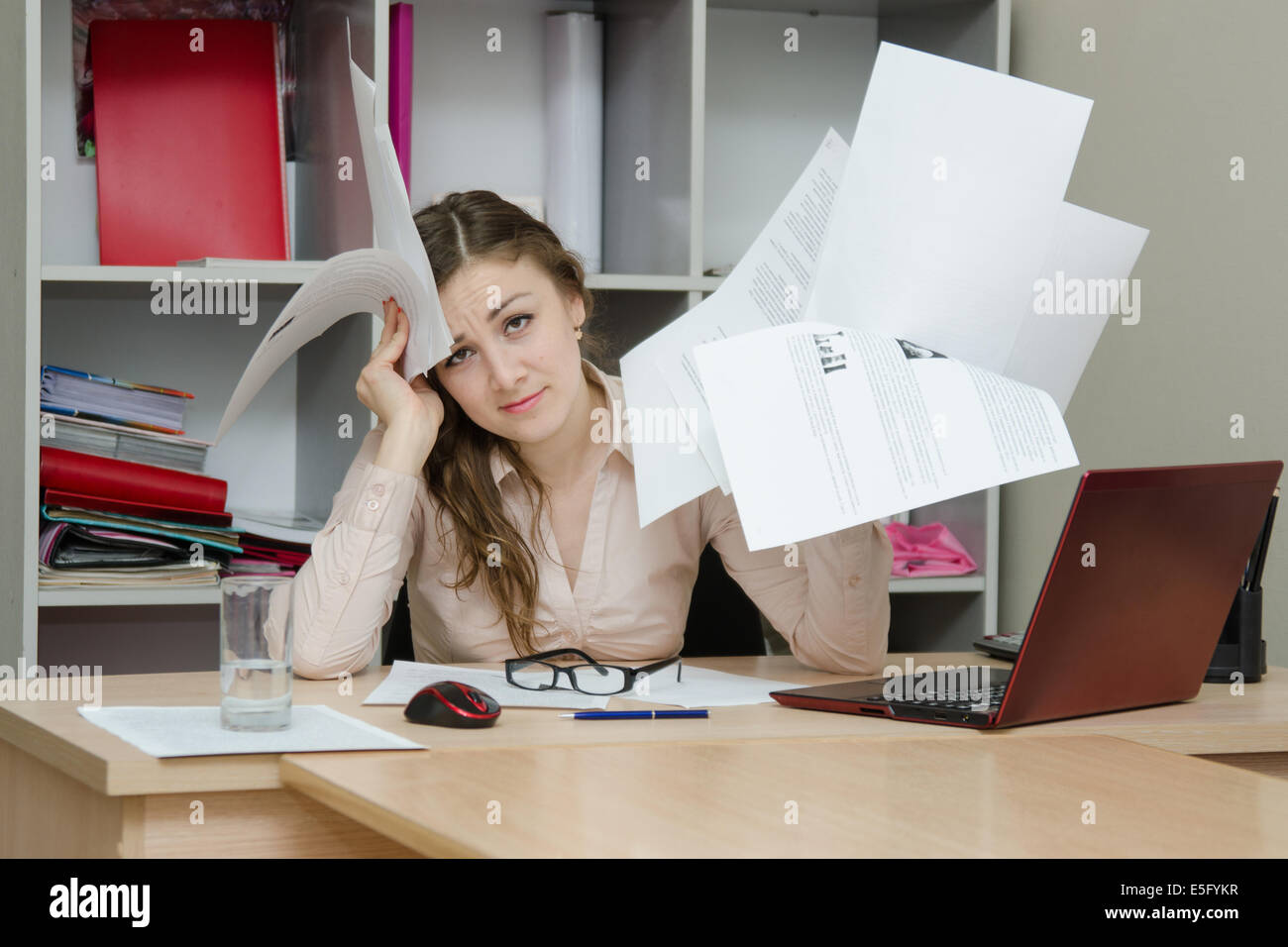 Young girl working at the desk in the office Stock Photo - Alamy