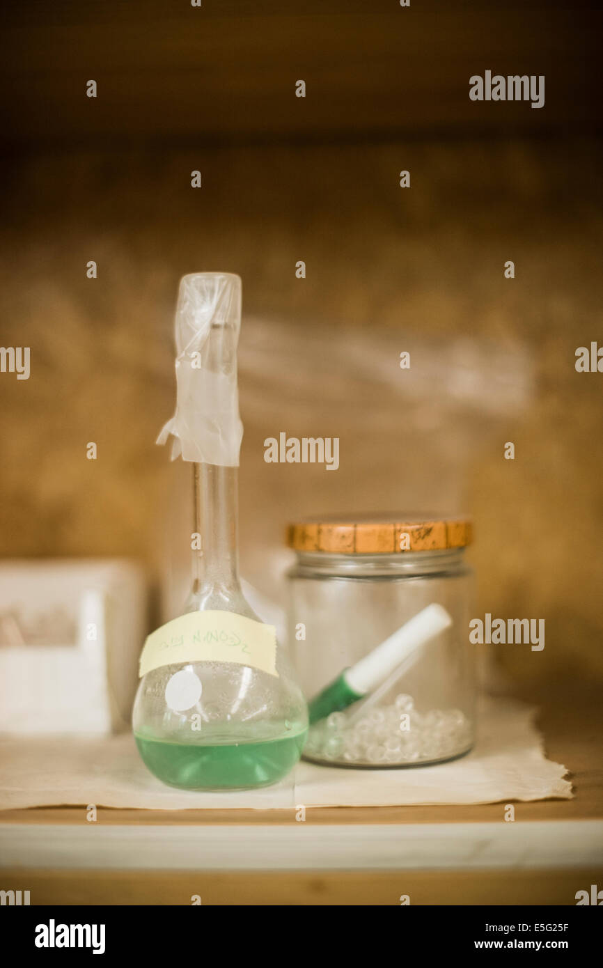Flask and jar on table Stock Photo - Alamy