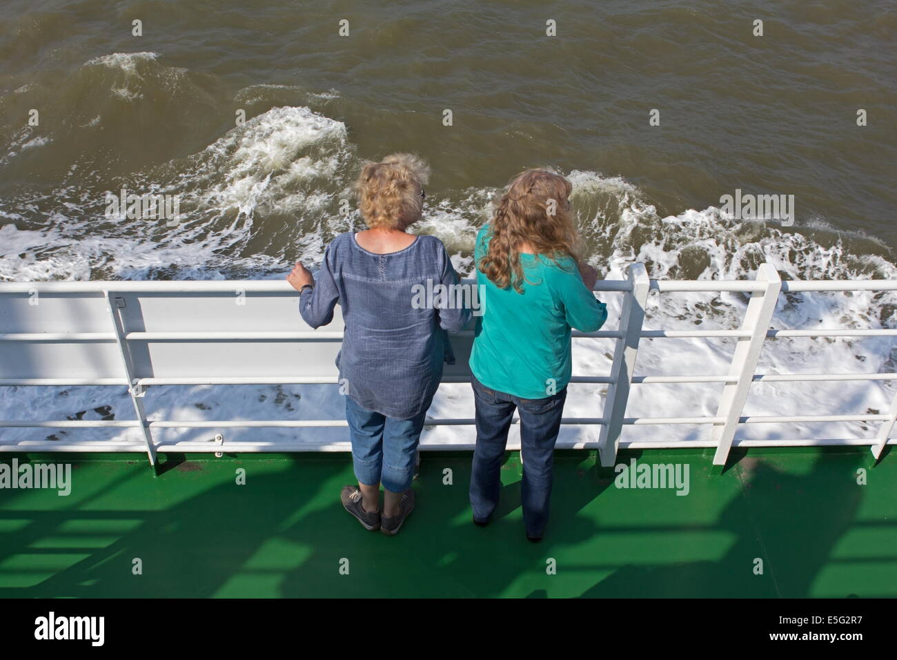 Borkum, Germany: July 29, 2014, guests at the railing on the ferry to ...