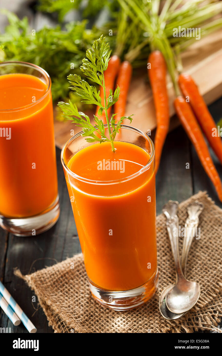 Organic Raw Carrot Juice with Fresh Fruit Stock Photo - Alamy