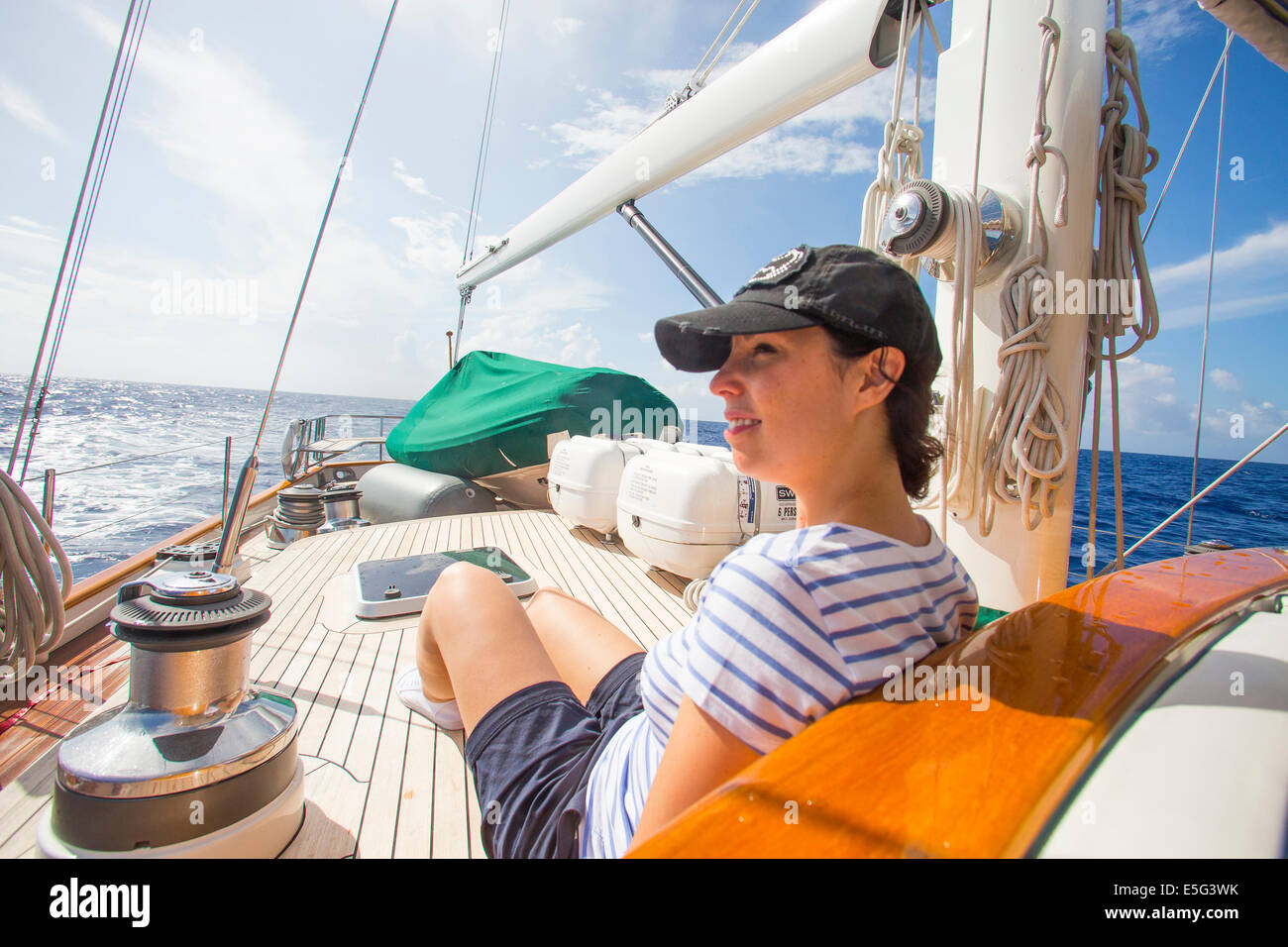 Woman relaxing on boat Stock Photo - Alamy