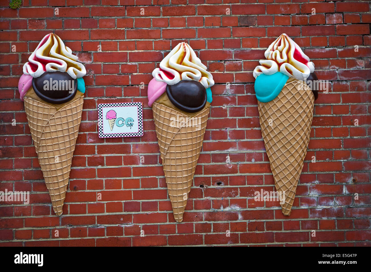 Promotional plastic ice-creams on wall Stock Photo - Alamy