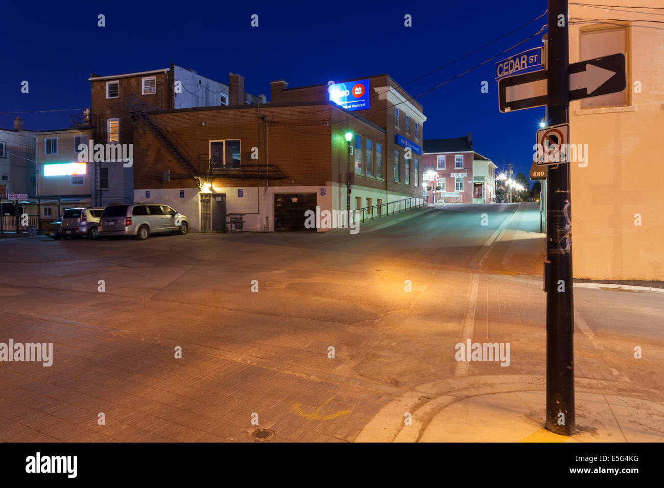 Timothy St. at dusk in Downtown Newmarket with the back of the Bank of ...