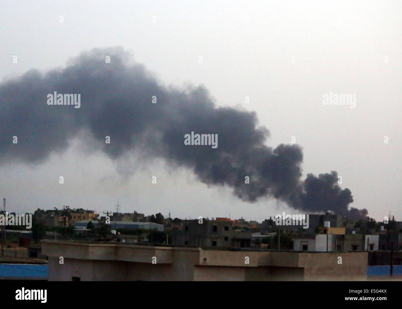 Tripoli, Libya. 30th July, 2014. Heavy smoke rises from Brega oil-depot ...