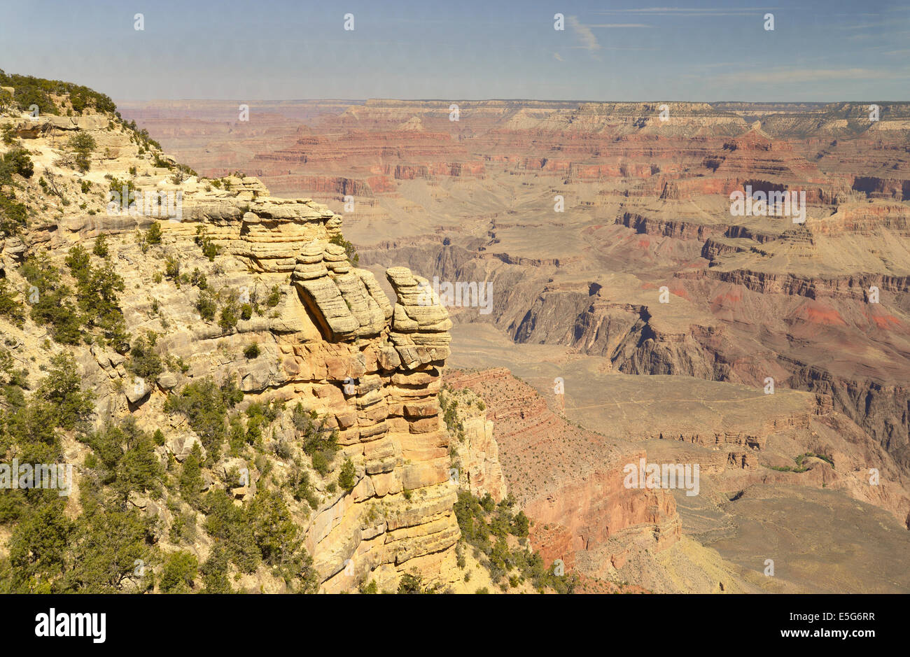 A steep cliff on the rim with the canyon landscape as a backdrop Stock ...