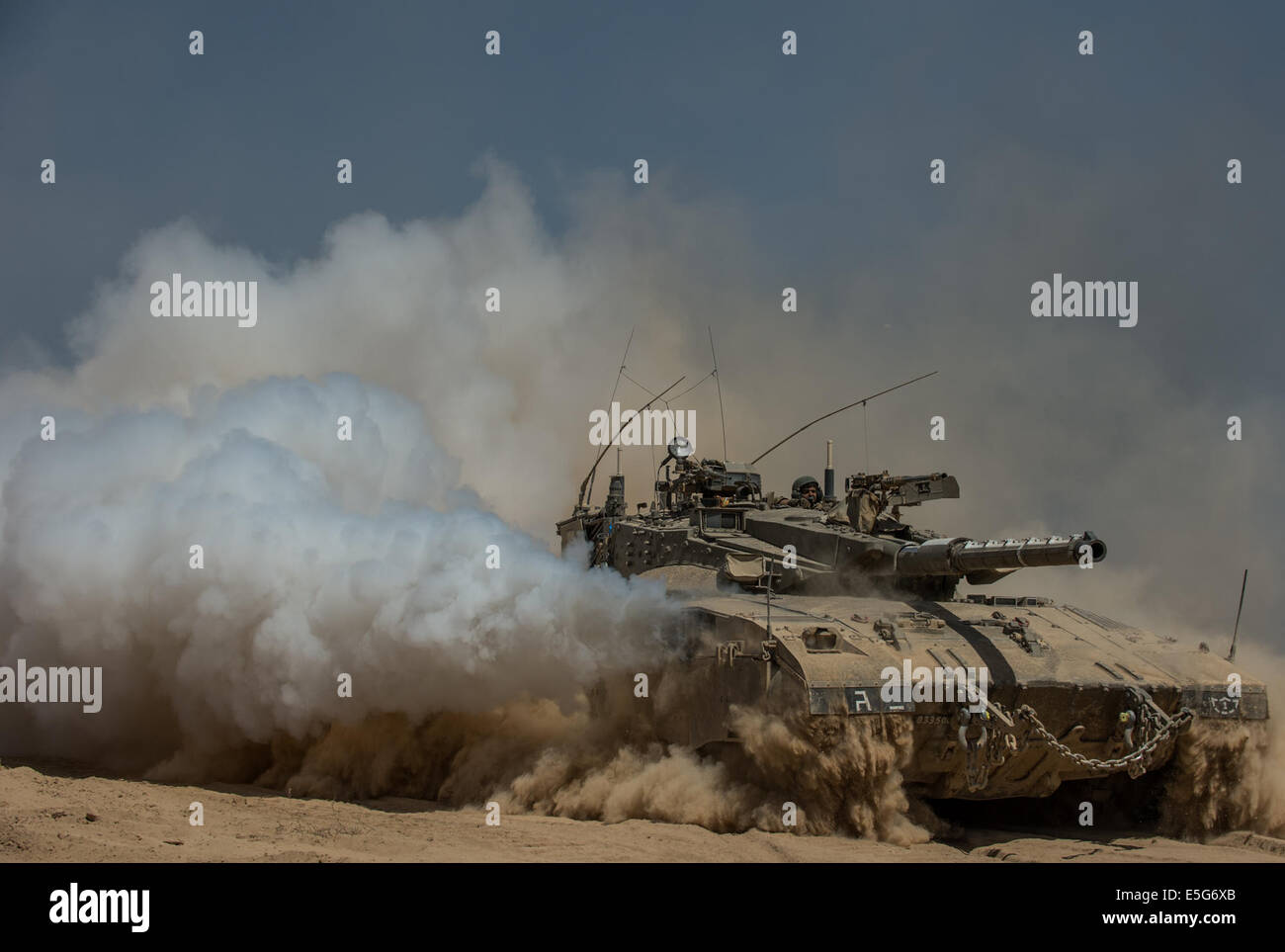 Gaza Border. 30th July, 2014. An Israeli Merkava tank runs in the field ...