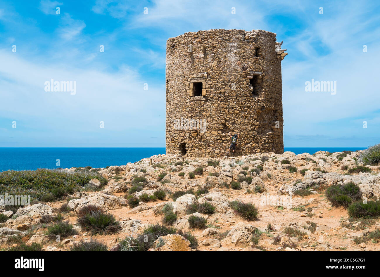 Spanish tower on the promontory of Cala Domestica, an isolated and wild ...