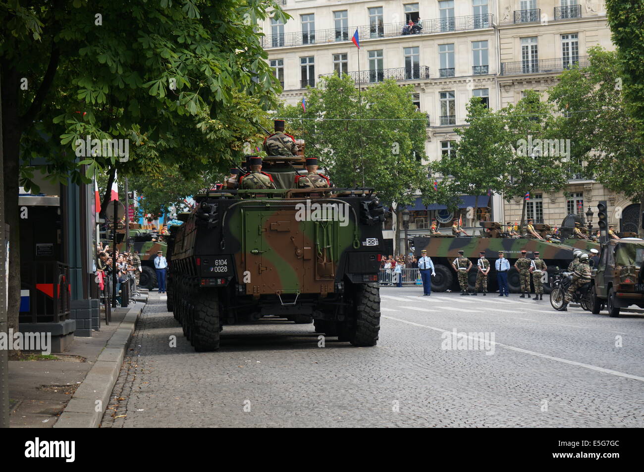 Rear view of a tank, side view of another tank and soldiers on Avenue ...