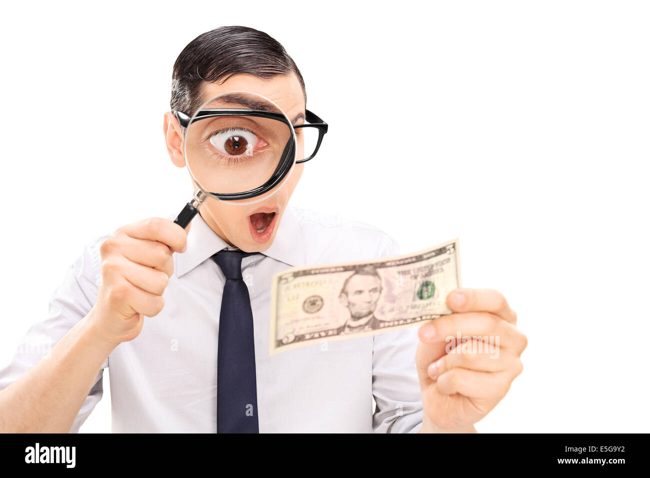 Excited man looking at dollar bill with magnifier Stock Photo - Alamy