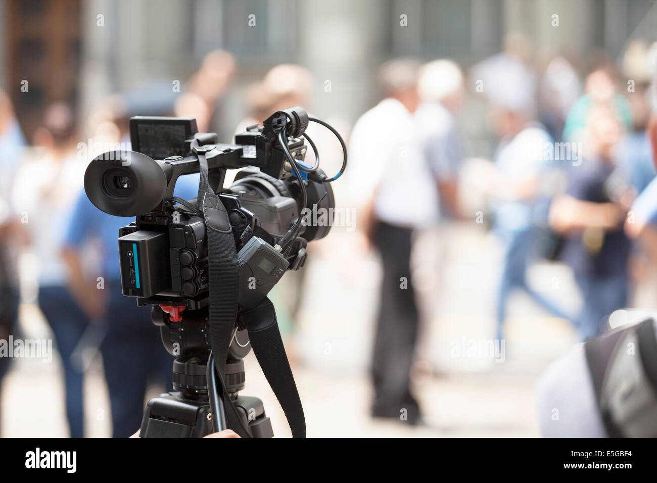 filming an event with a video camera Stock Photo - Alamy