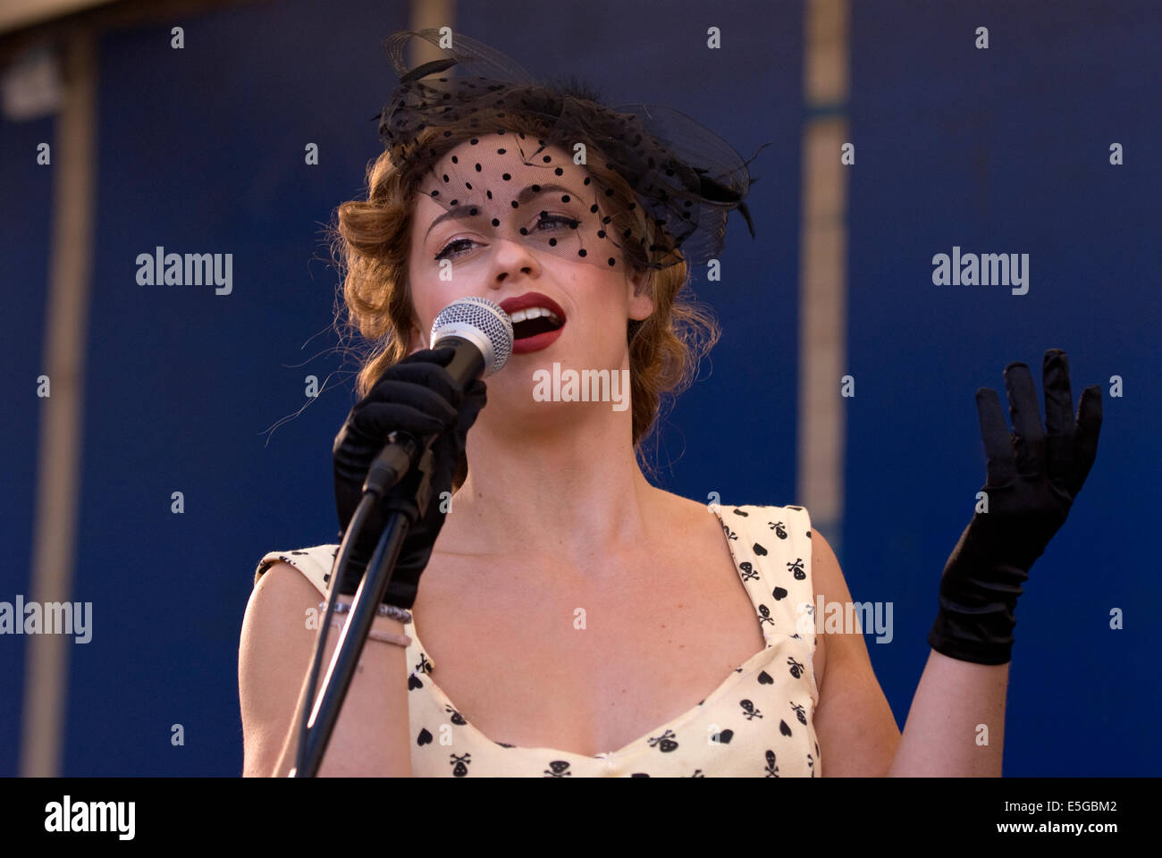 Singer Jeradine Hume in 1940s/50s costume entertaining the crowds at a ...
